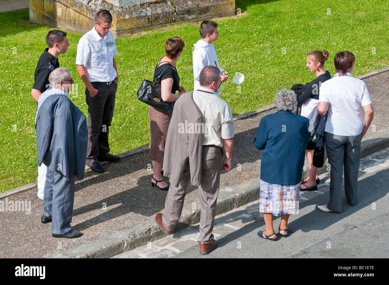 Group of nine people gathering before Sunday Mass in church - France ...