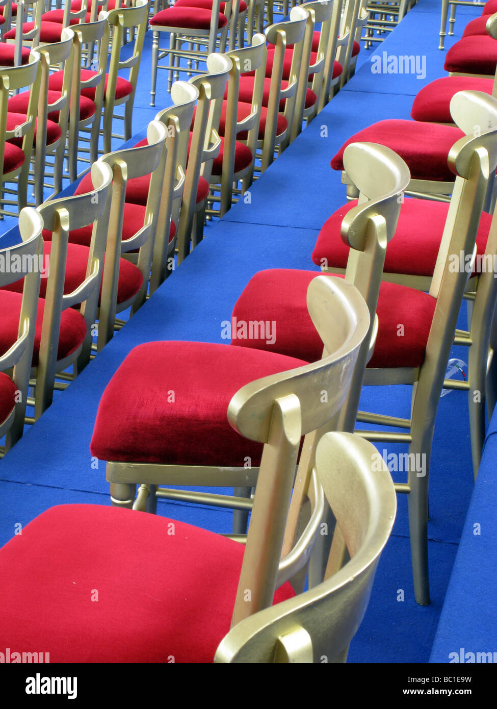 rows of red gold chairs for vip at an outdoor parade event Stock Photo ...