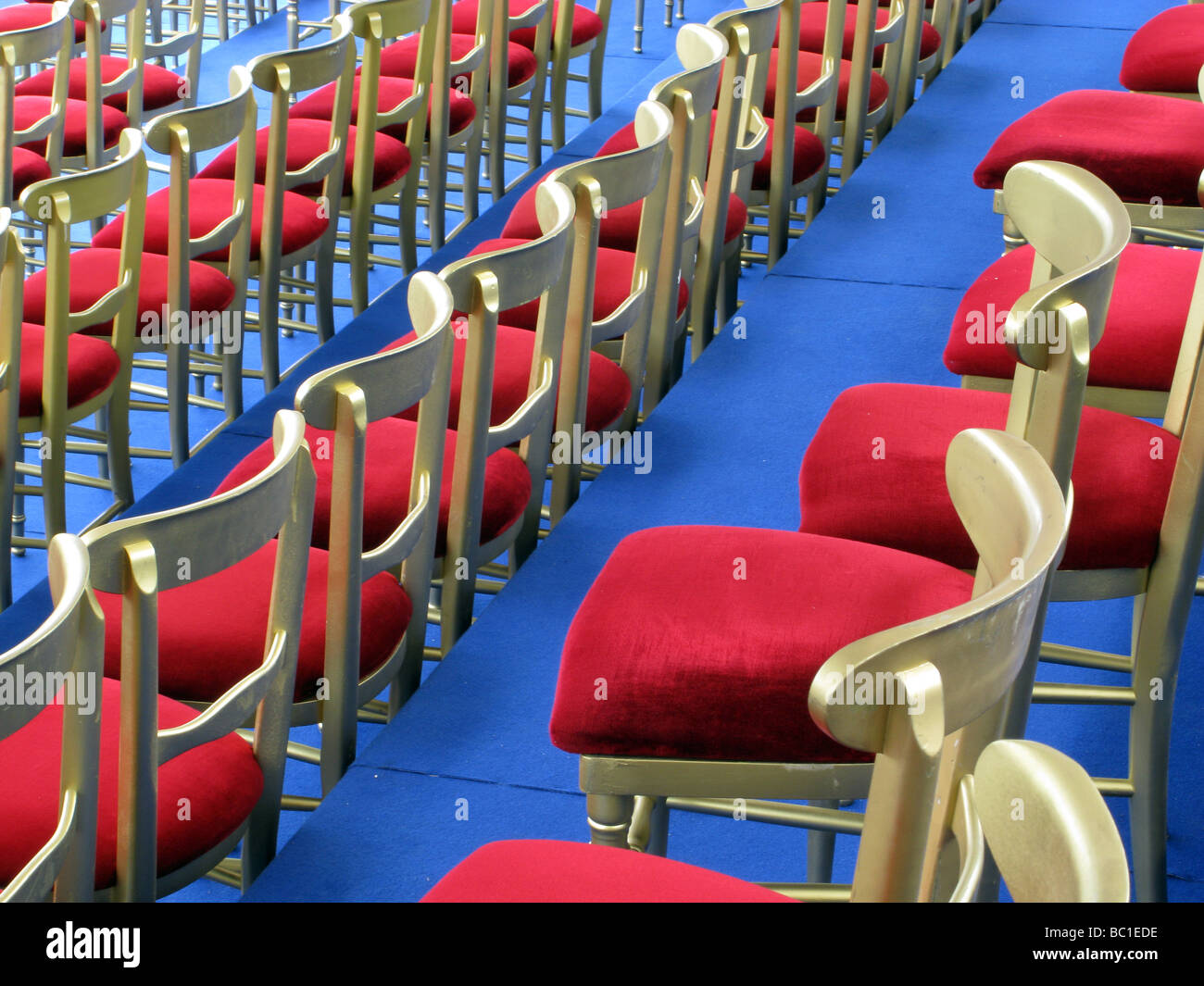 rows of red gold chairs for vip at an outdoor parade event Stock Photo ...