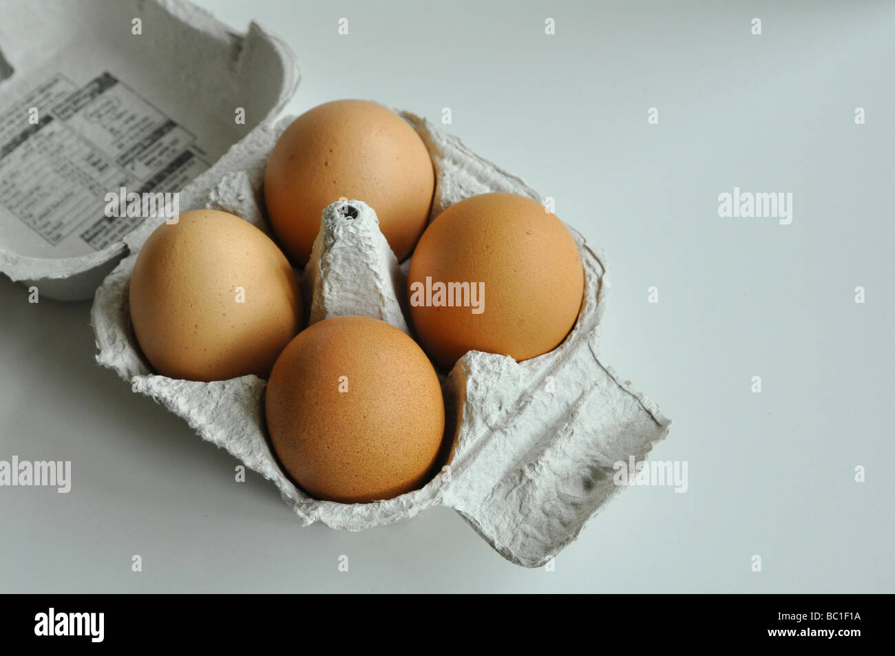 Top View of Four Organic Eggs in a Cardboard Box Stock Photo - Alamy