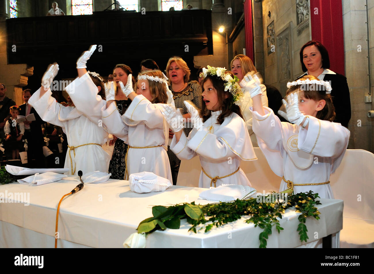 First Communion in Catholic Church children Stock Photo - Alamy