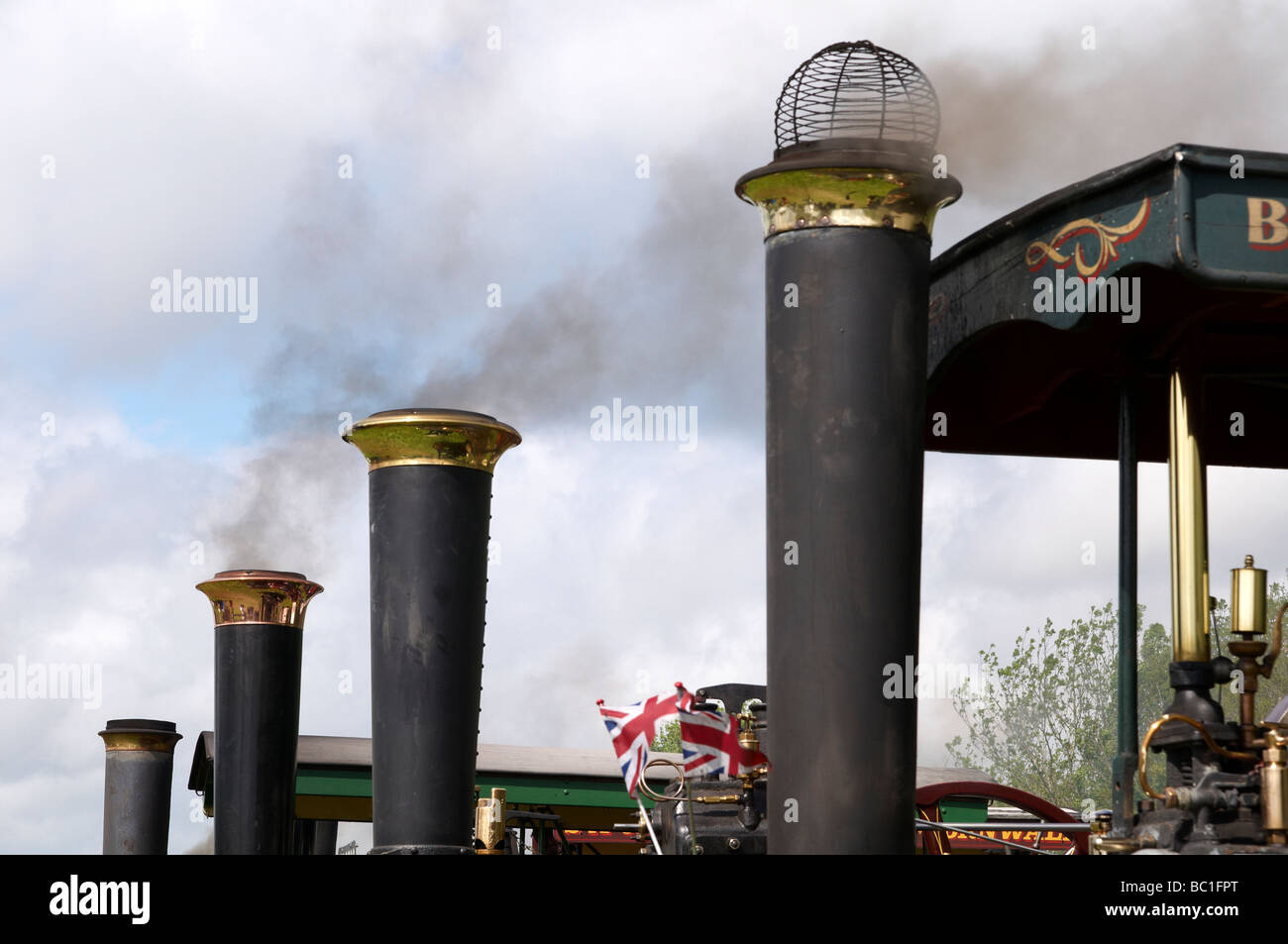 Smoking traction engine chimneys Stock Photo - Alamy