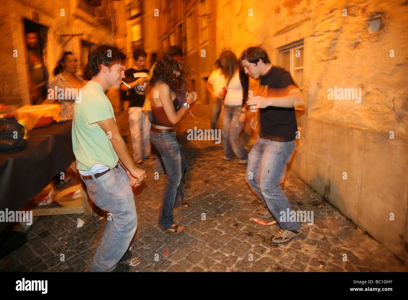 Dancing in the streets during the festival of Santos populares Lisbon ...