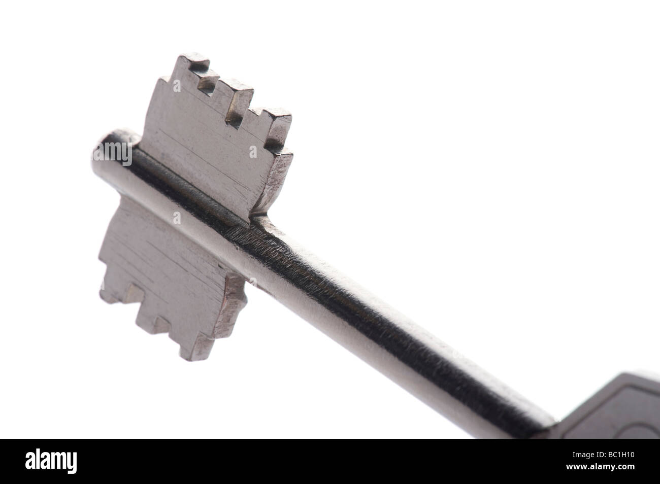 object on white metal key close up Stock Photo - Alamy