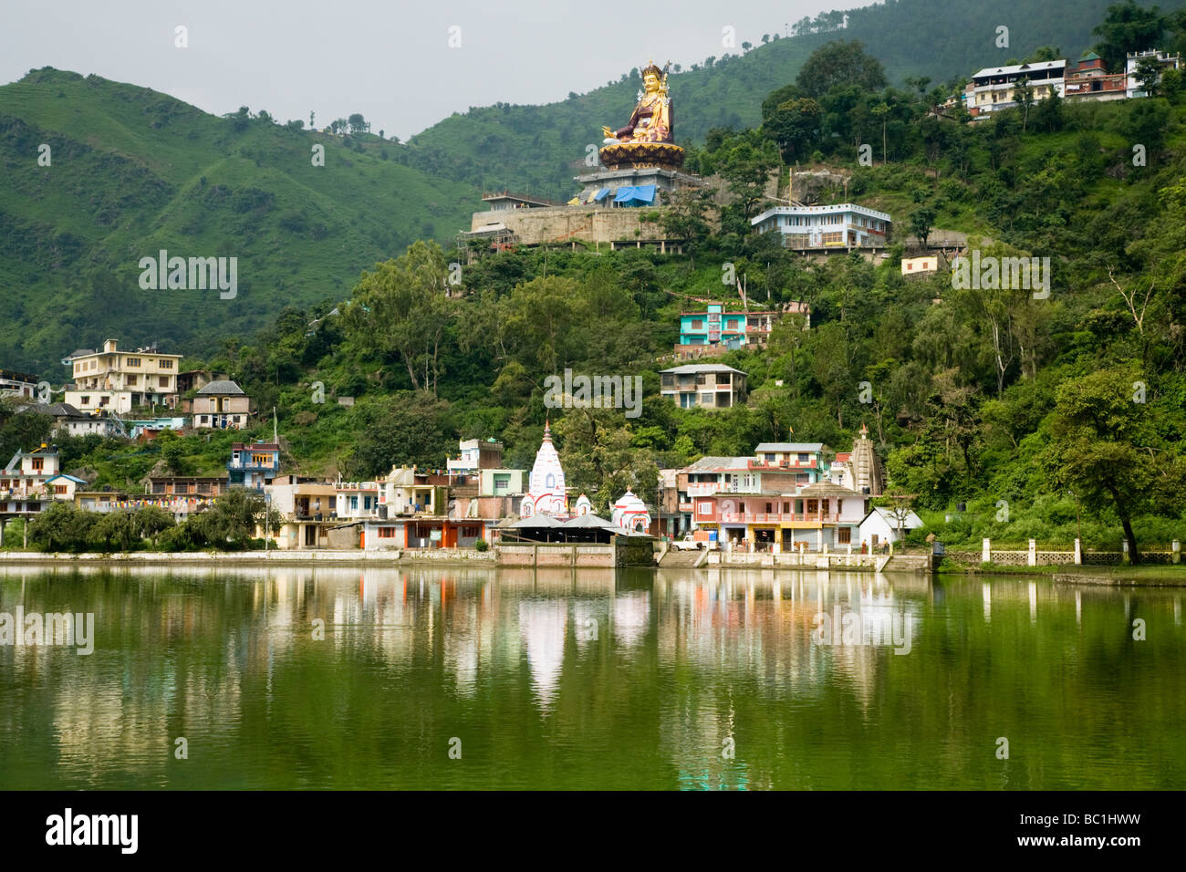 Rewalsar lake, with statue of Acharya Padmasambhav on the hillside ...