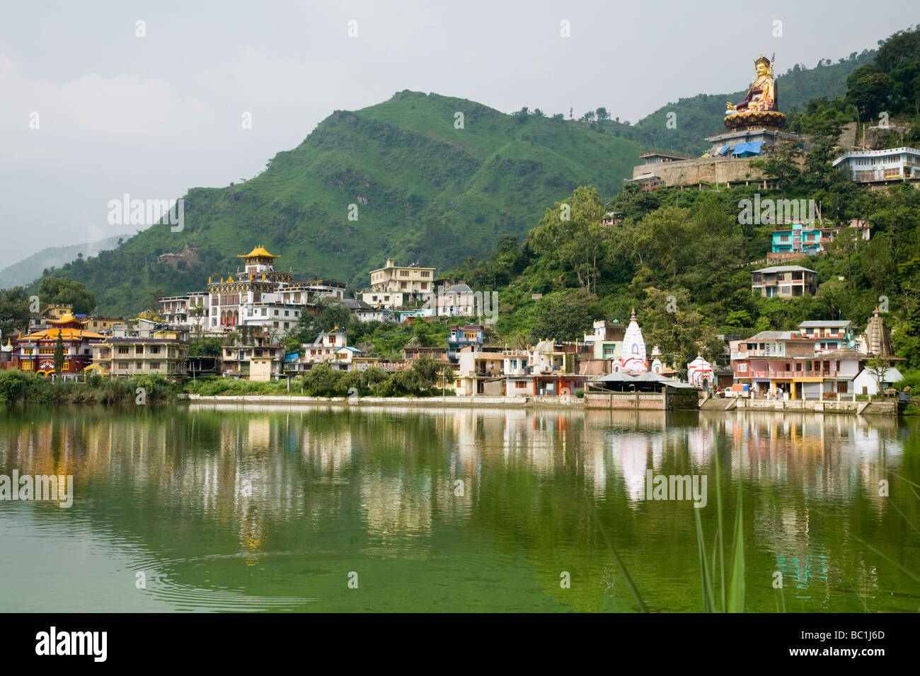 Rewalsar lake, with statue of Acharya Padmasambhav on the hillside ...