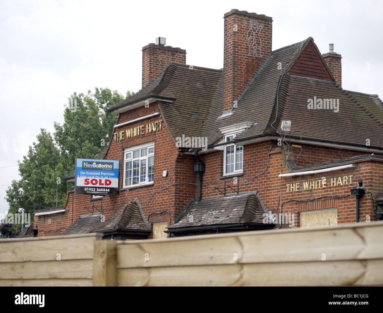 White Hart pub in Chessington Surrey UK with a sold sign de-licenced ...