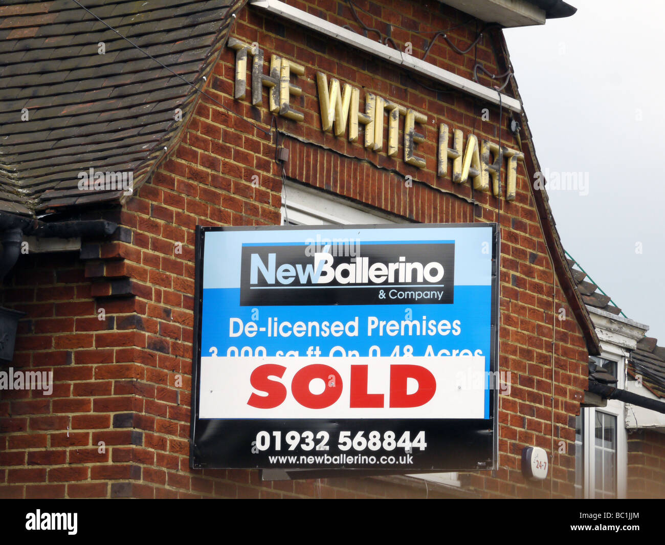 White Hart pub in Chessington Surrey UK with a sold sign de-licenced ...