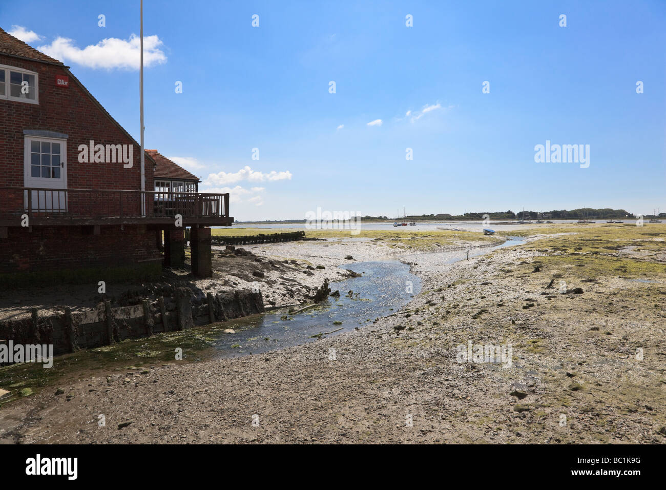 Attractive waterfront mill in the village of Langstone seen at low tide ...