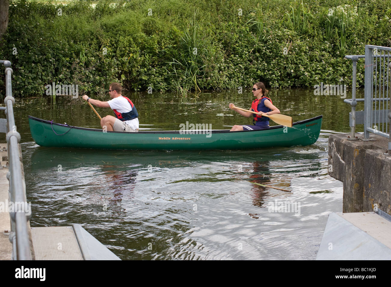 canadian canoeists fish pass canoeing canoe river medway kent england ...
