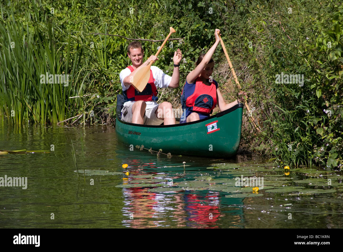 canadian canoeists fish pass canoeing canoe river medway kent england ...