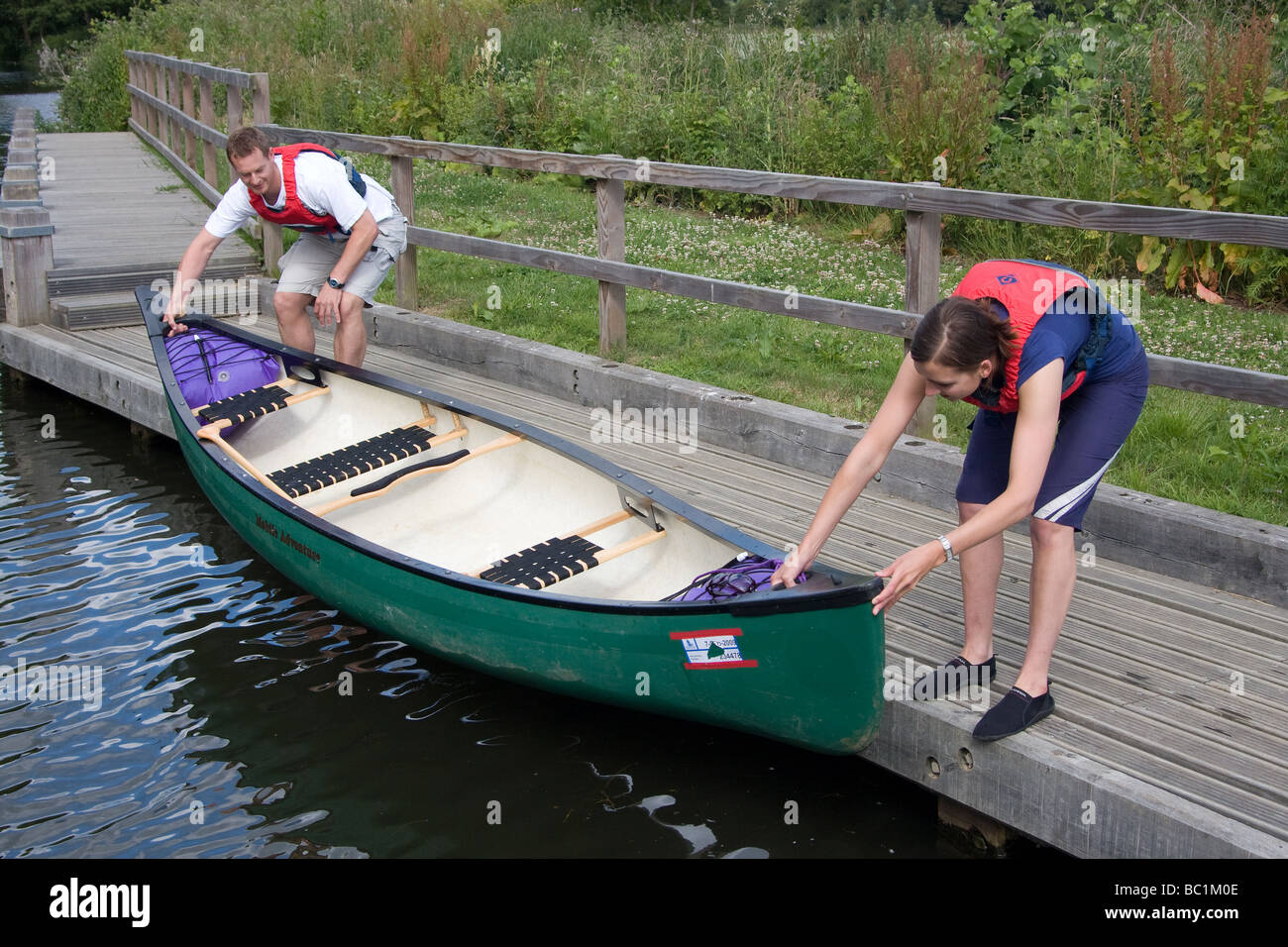 canadian canoeists fish pass canoeing canoe river medway kent england ...