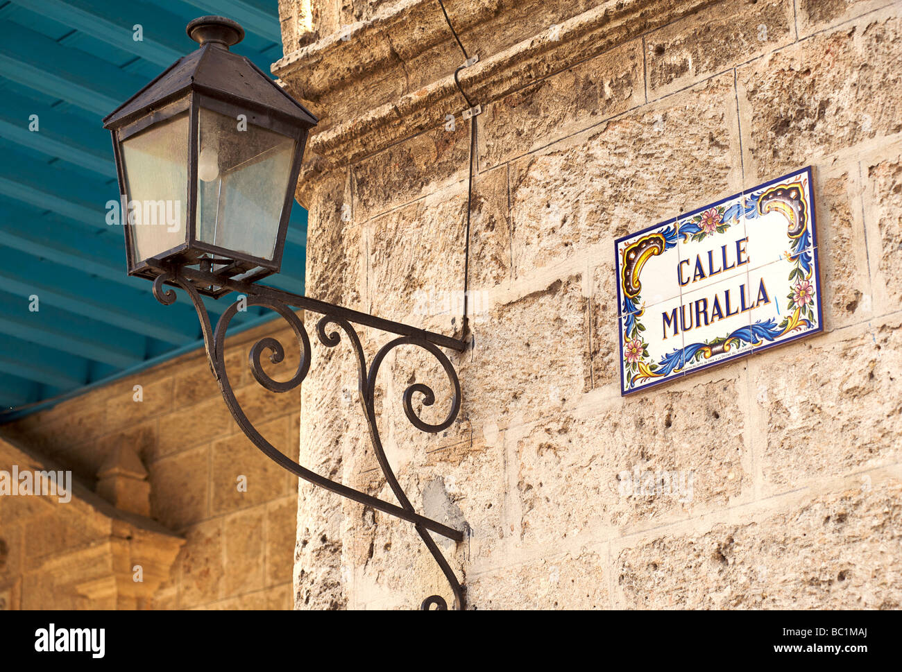 Detail of street sign and lantern. CALLE MURALLA, Old Havana, Cuba ...