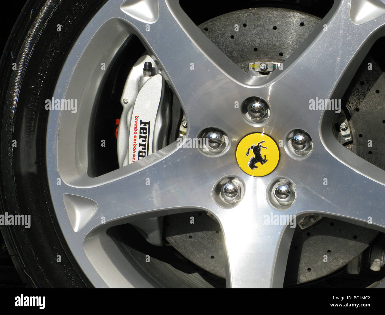 one blue ferrari sports car in street in rome italy Stock Photo - Alamy