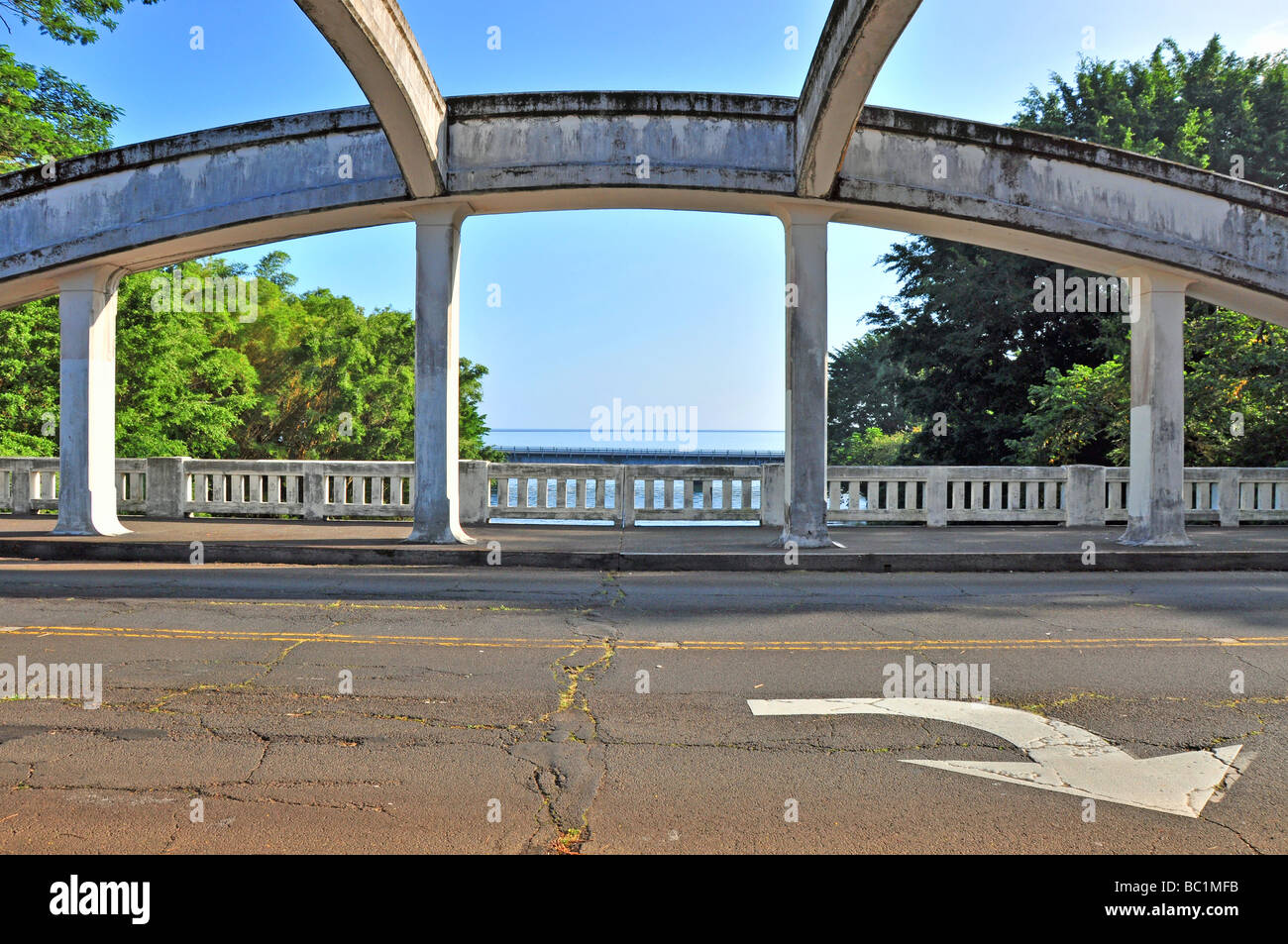 Looking through the arches of a bridge towards the Pacific Ocean from ...