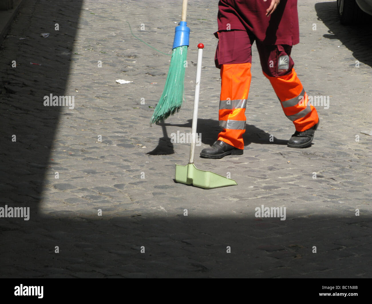 Workman cleaning pavement hi-res stock photography and images - Alamy
