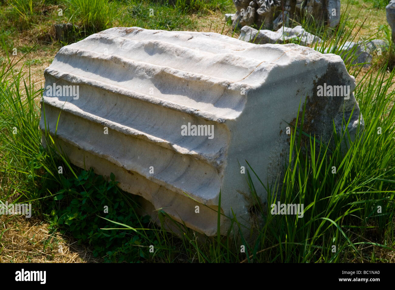 Ruined stone columns lying on the ground in the Agora an ancient Greek ...