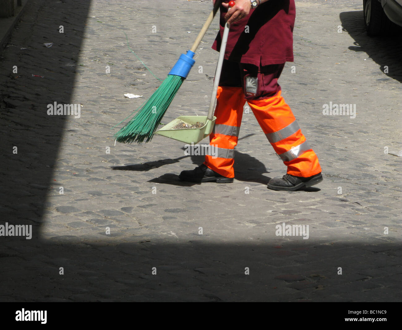 woman cleaning road in city town Stock Photo - Alamy