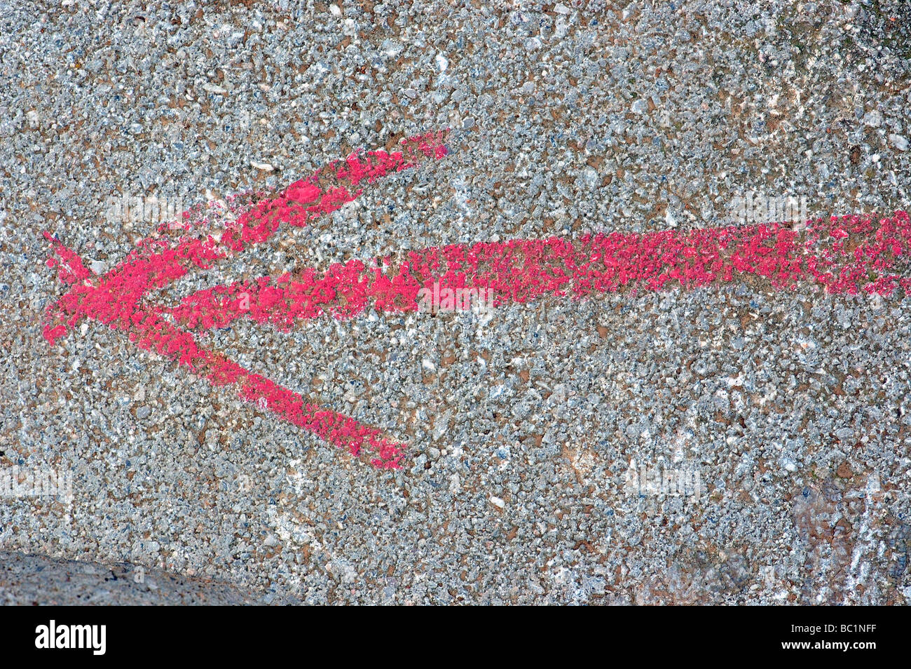 Arrow sign painted on stone surface. Abstract background texture Stock ...