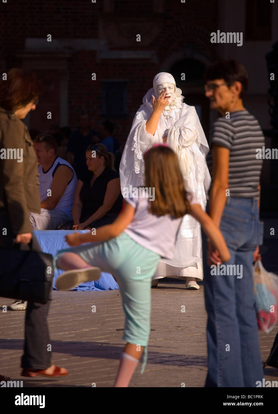 White Lady woman street performer at Main Market Square Krakow Poland ...