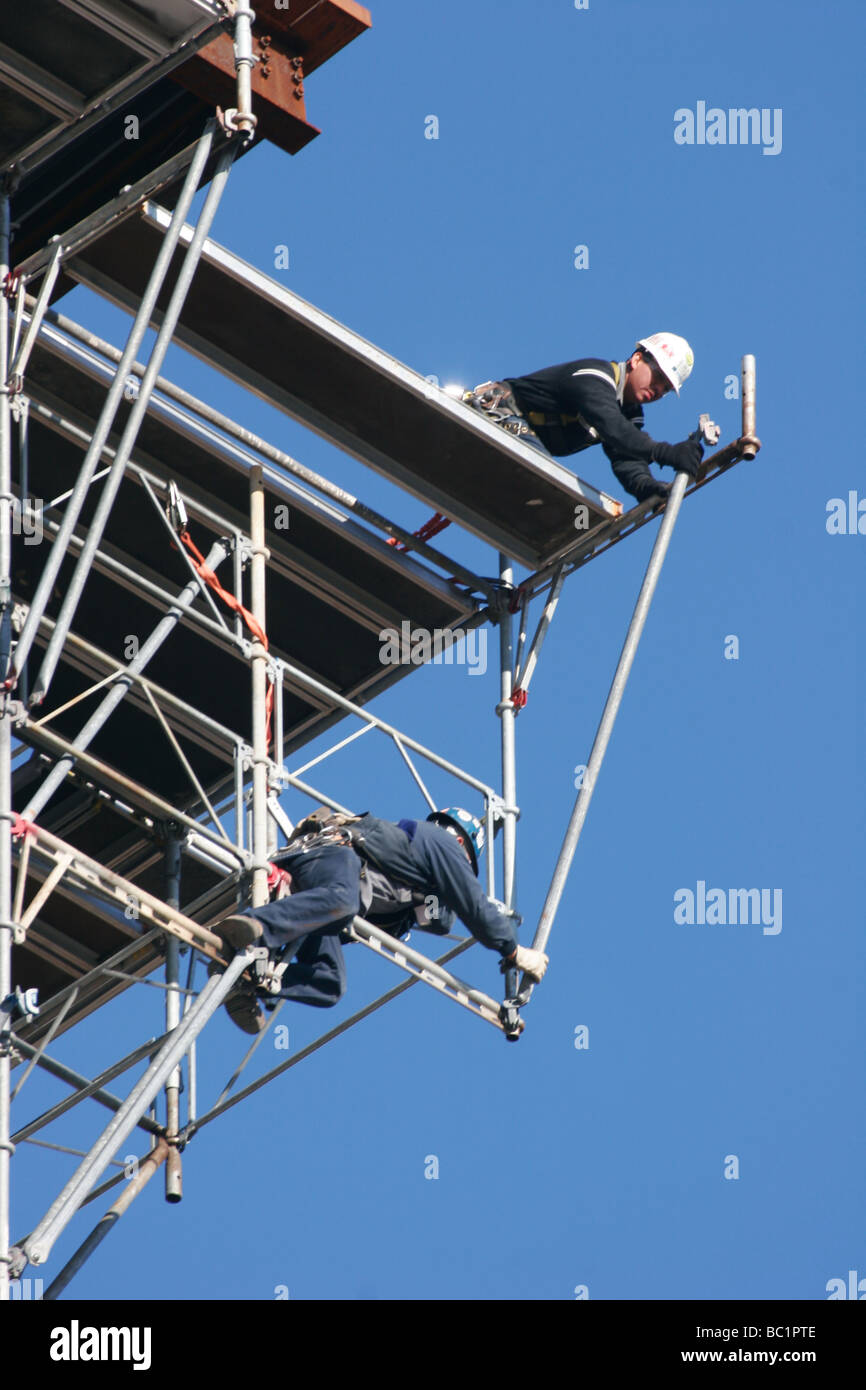 Men at work in high rise building hi-res stock photography and images ...