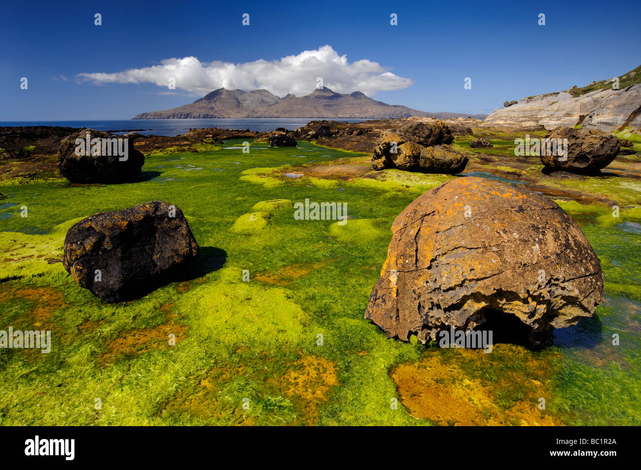 A view of Rum from Laig Bay, Isle of Eigg, Inner Hebrides, Scotland ...