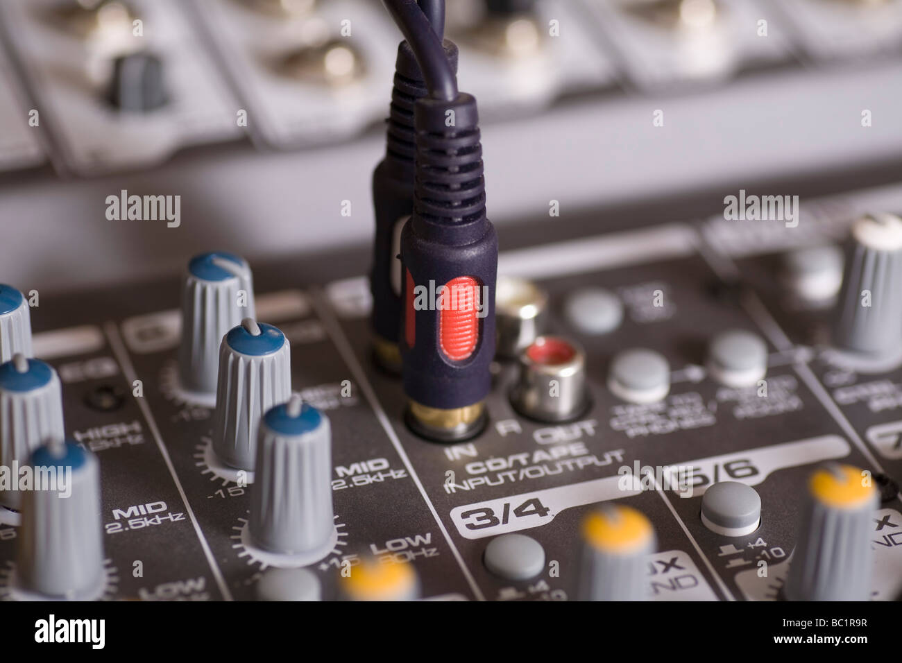 Mixing console with wires plugged in Stock Photo - Alamy