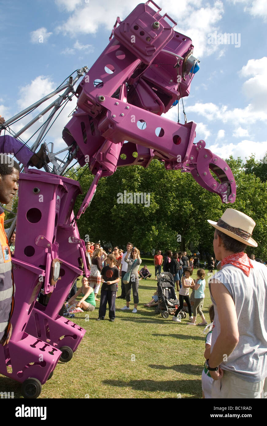 Giant motor controlled robot made out of pink garbage or rubbish bins ...