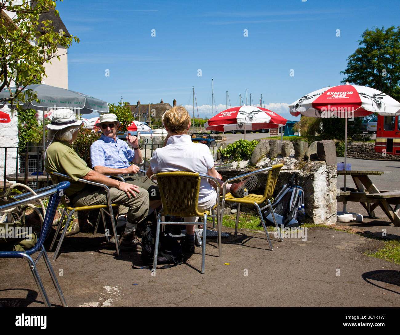 People enjoying in the Ship Inn Pub tea garden at Porlock Weir Somerset ...