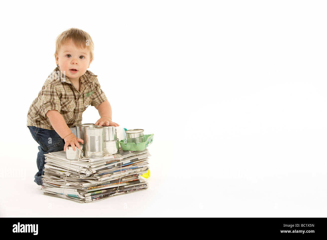 Young Boy Recycling In Studio Stock Photo - Alamy