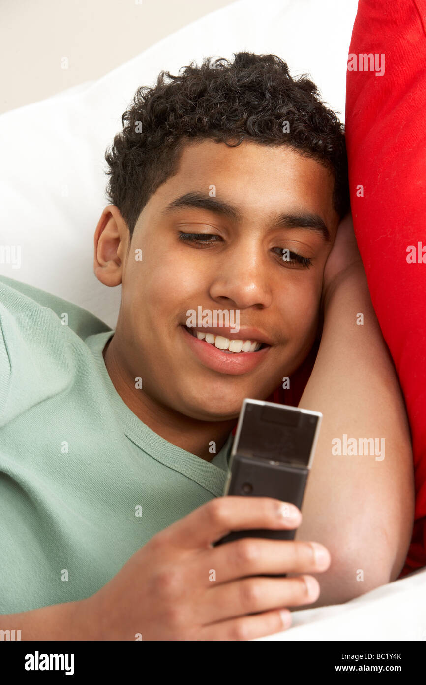 Young Boy Reading Text Message Stock Photo - Alamy