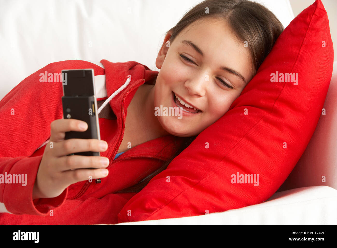 Young Girl Reading Text Message Stock Photo - Alamy