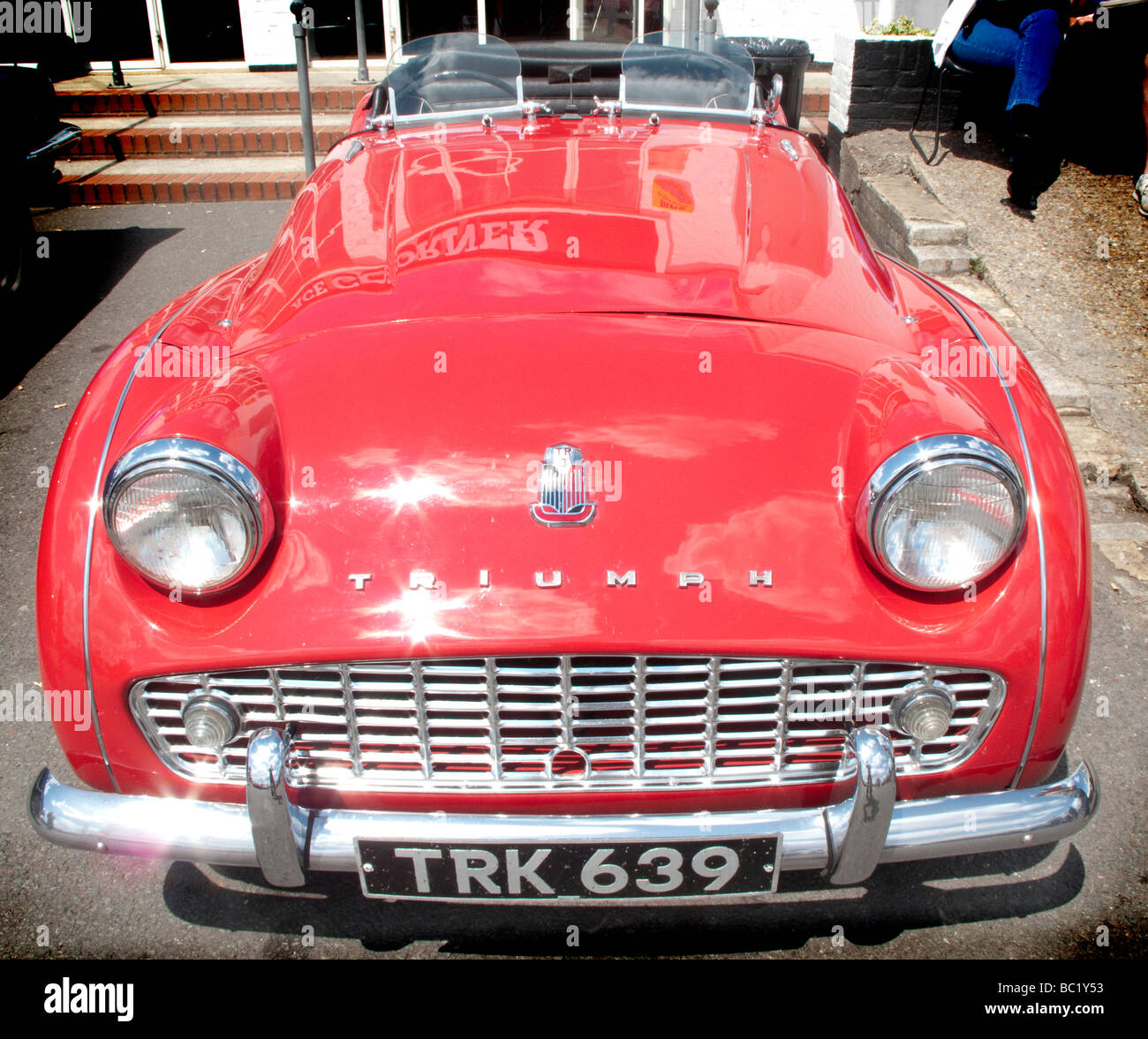 An old Red Triumph car Stock Photo - Alamy