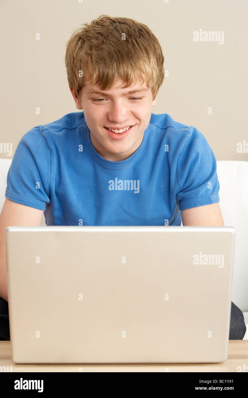 Young Boy Using Laptop At Home Stock Photo - Alamy