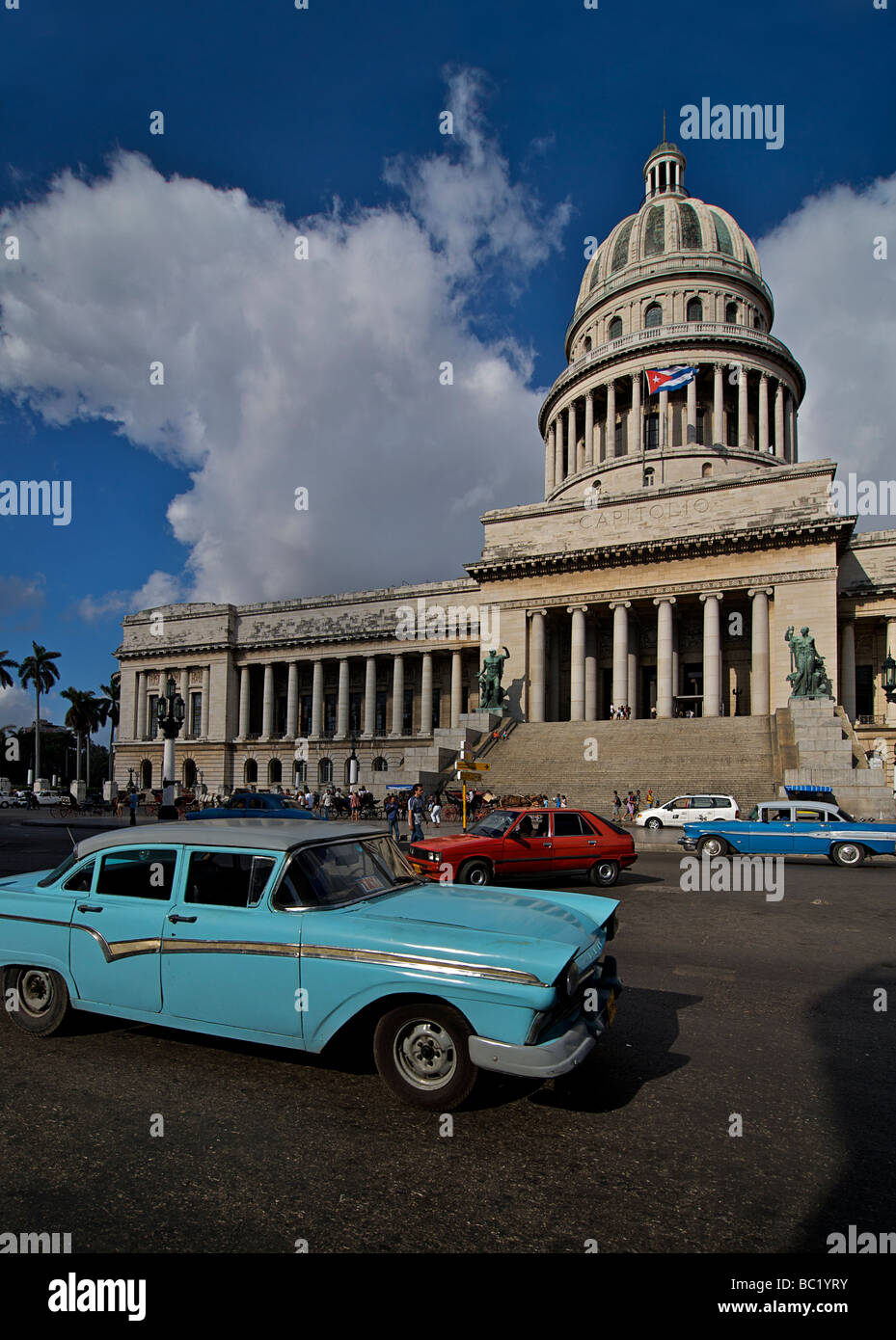 Classic American car. A cultural icon for modern day Cuba. Capitolio ...