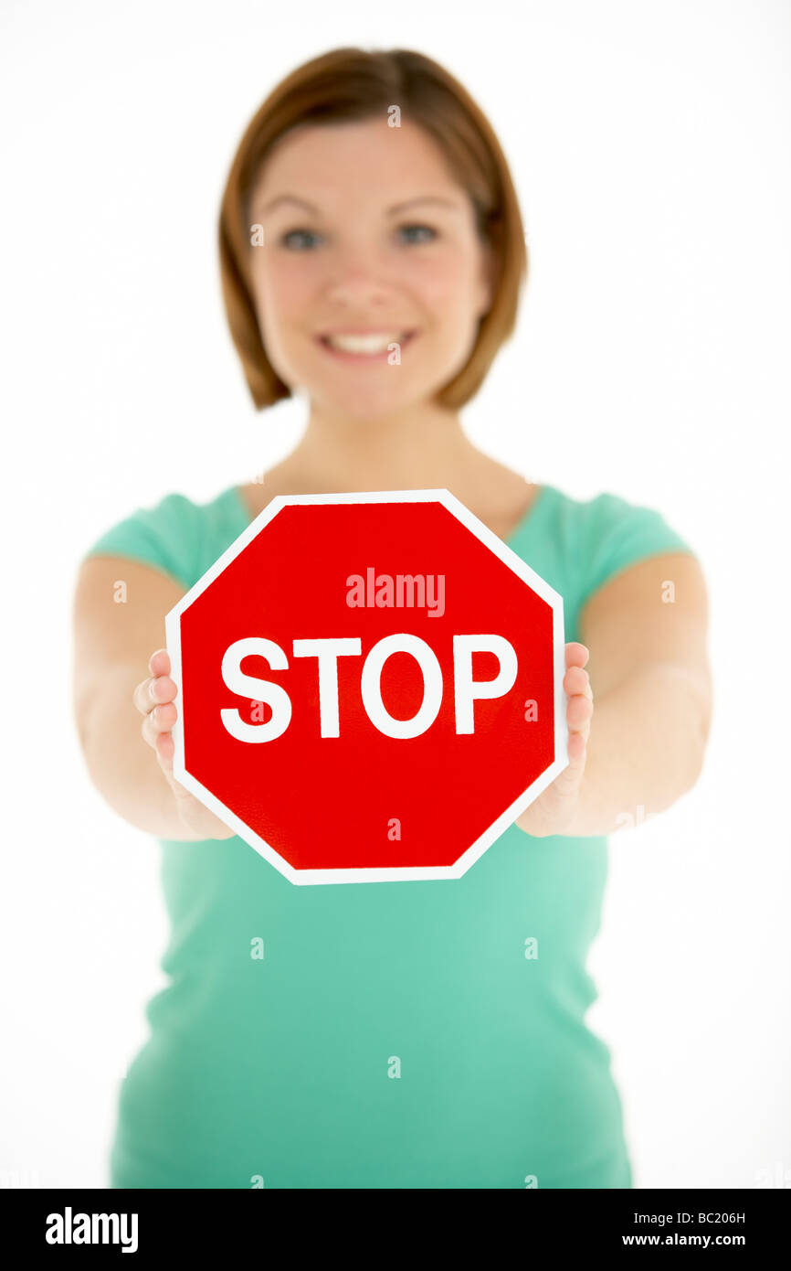 Woman Holding Road Traffic Sign Stock Photo - Alamy