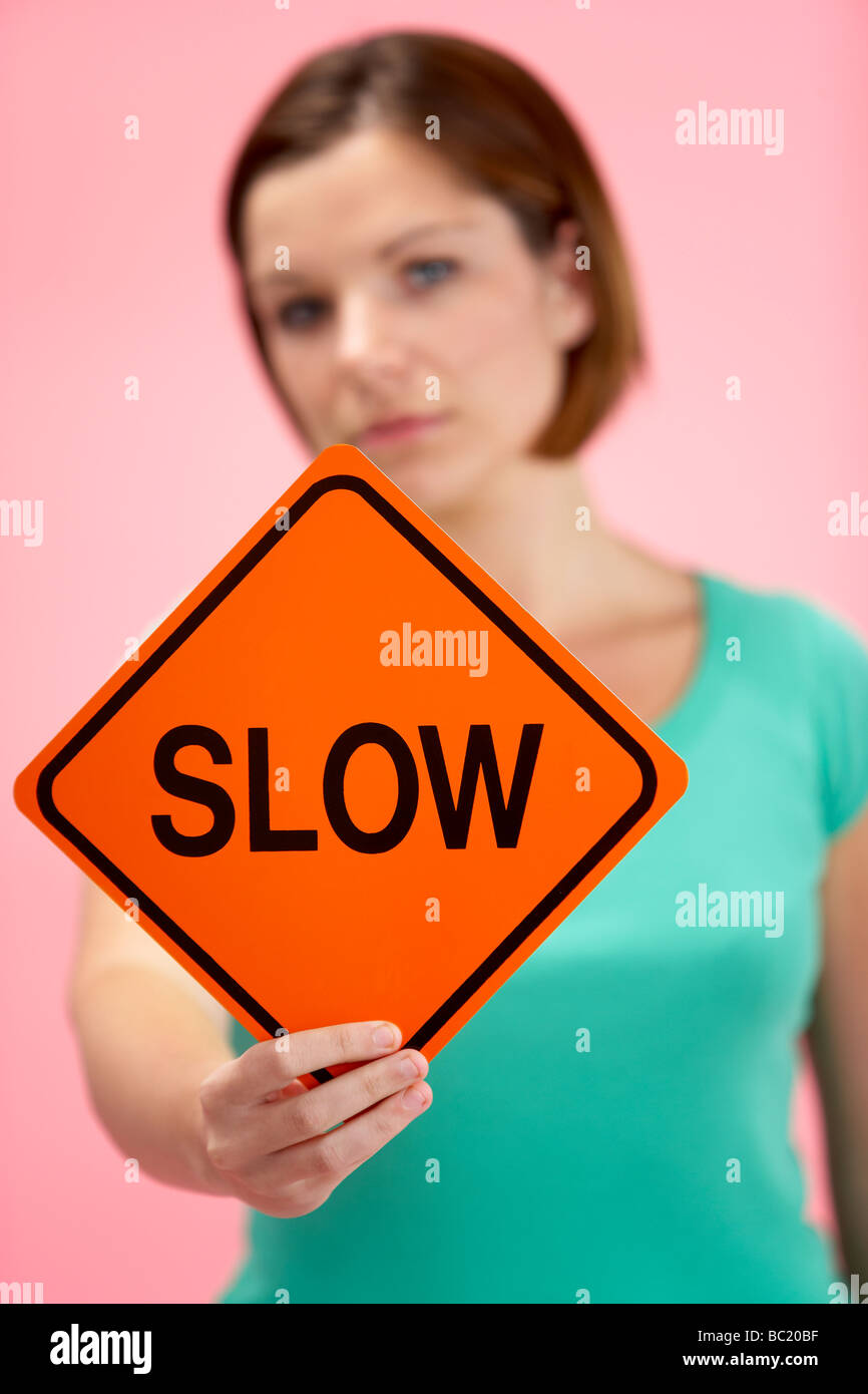 Woman Holding Road Traffic Sign Stock Photo - Alamy
