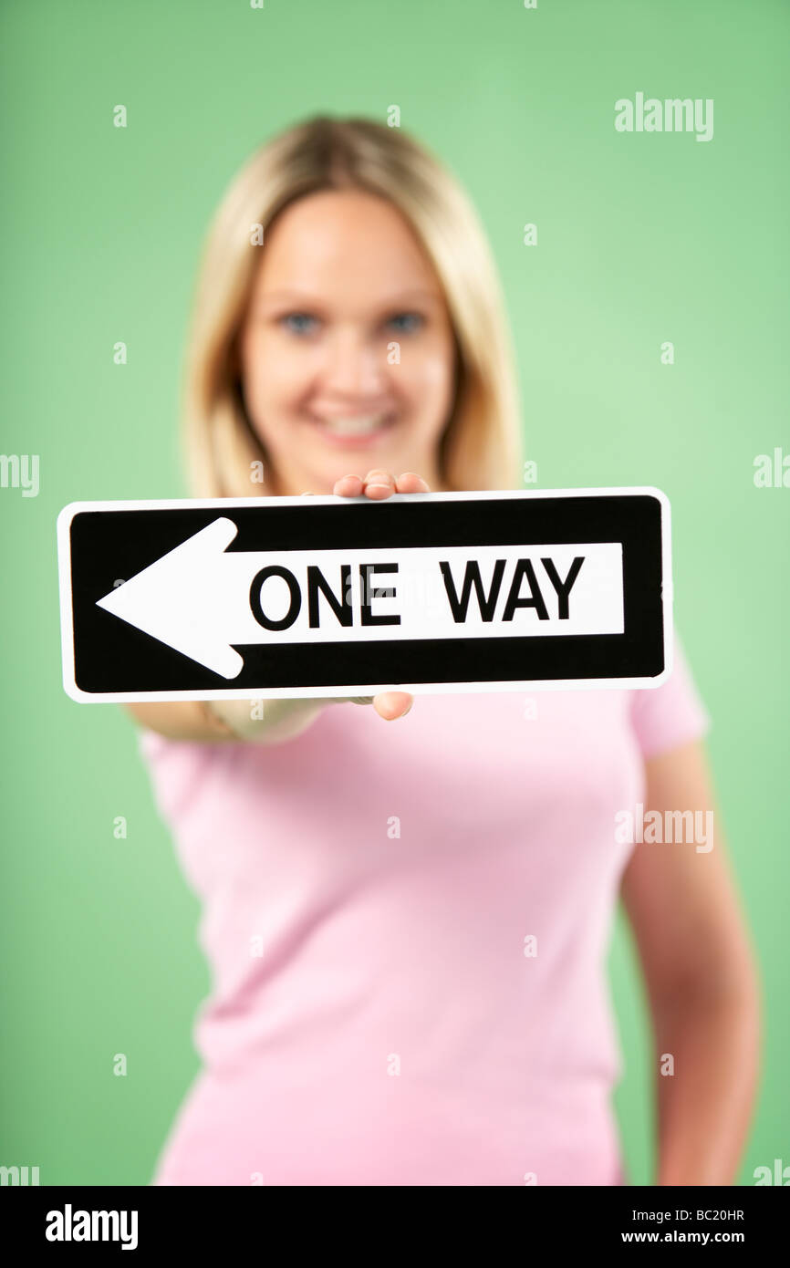 Woman Holding Road Traffic Sign Stock Photo - Alamy