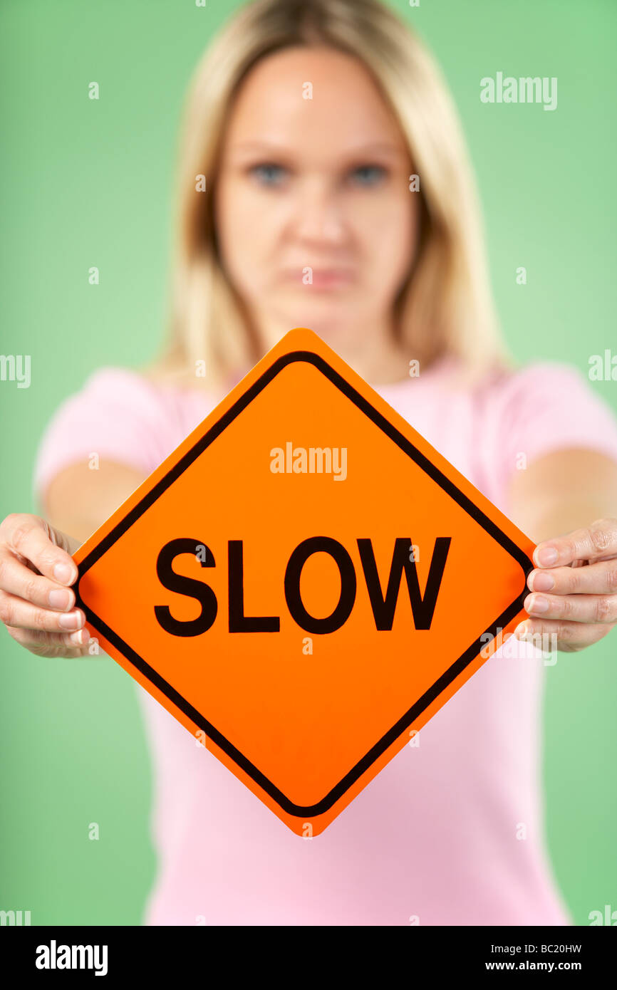 Woman Holding Road Traffic Sign Stock Photo - Alamy