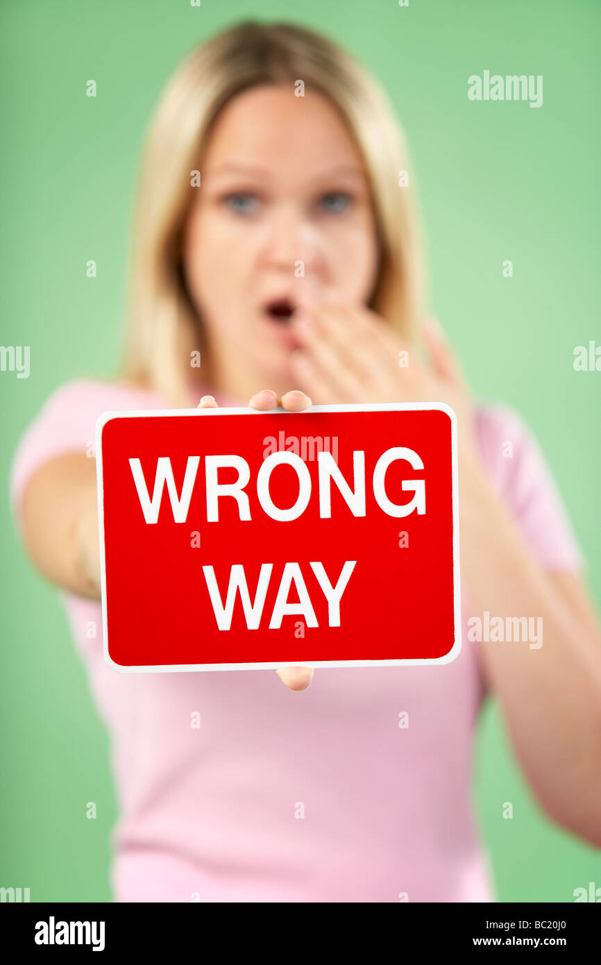 Woman Holding Road Traffic Sign Stock Photo - Alamy