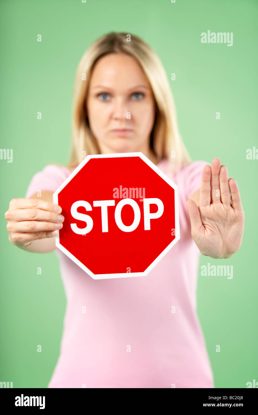 Woman stop sign hi-res stock photography and images - Alamy