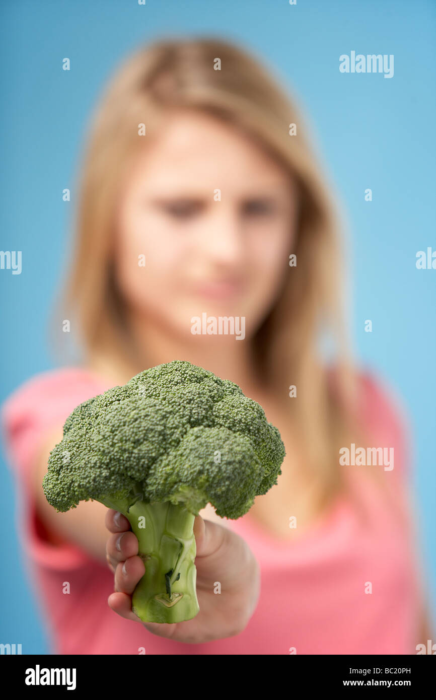Teenage Girl Holding Fresh Broccoli Stock Photo - Alamy