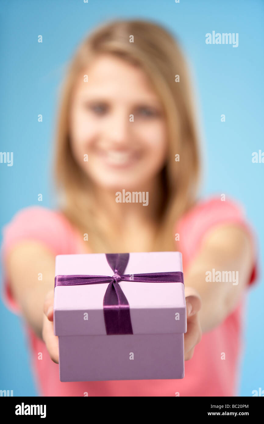 Teenage Girl Holding Gift Wrapped Box Stock Photo - Alamy