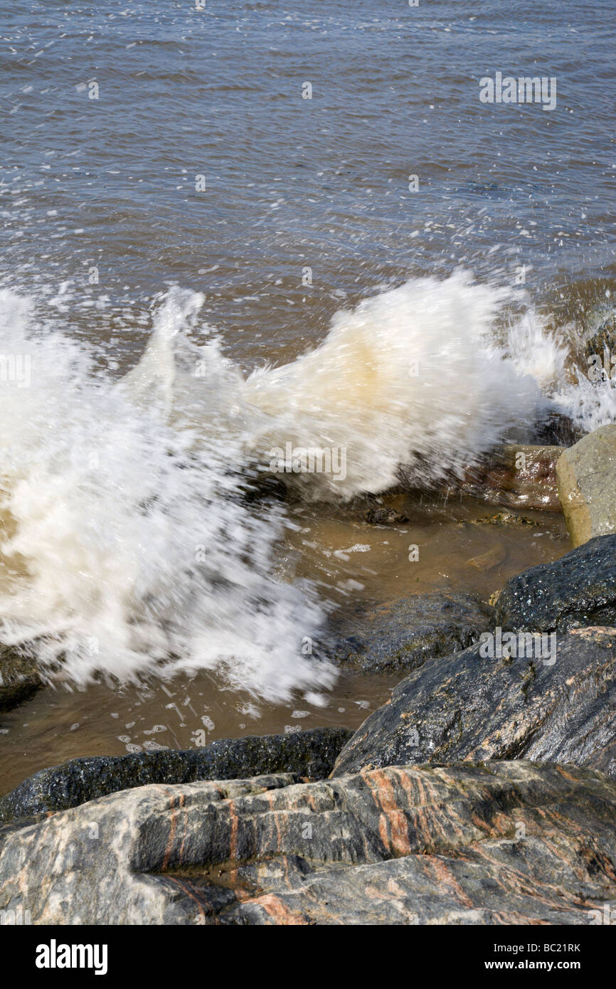 The sea crashing into rocks Stock Photo - Alamy