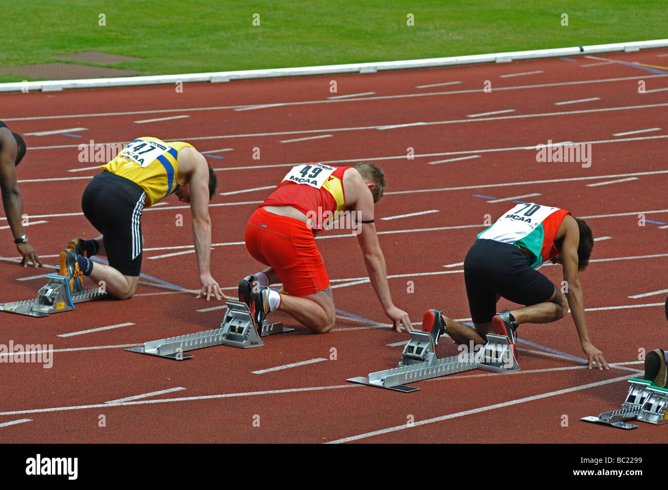 Runners in starting blocks Stock Photo - Alamy