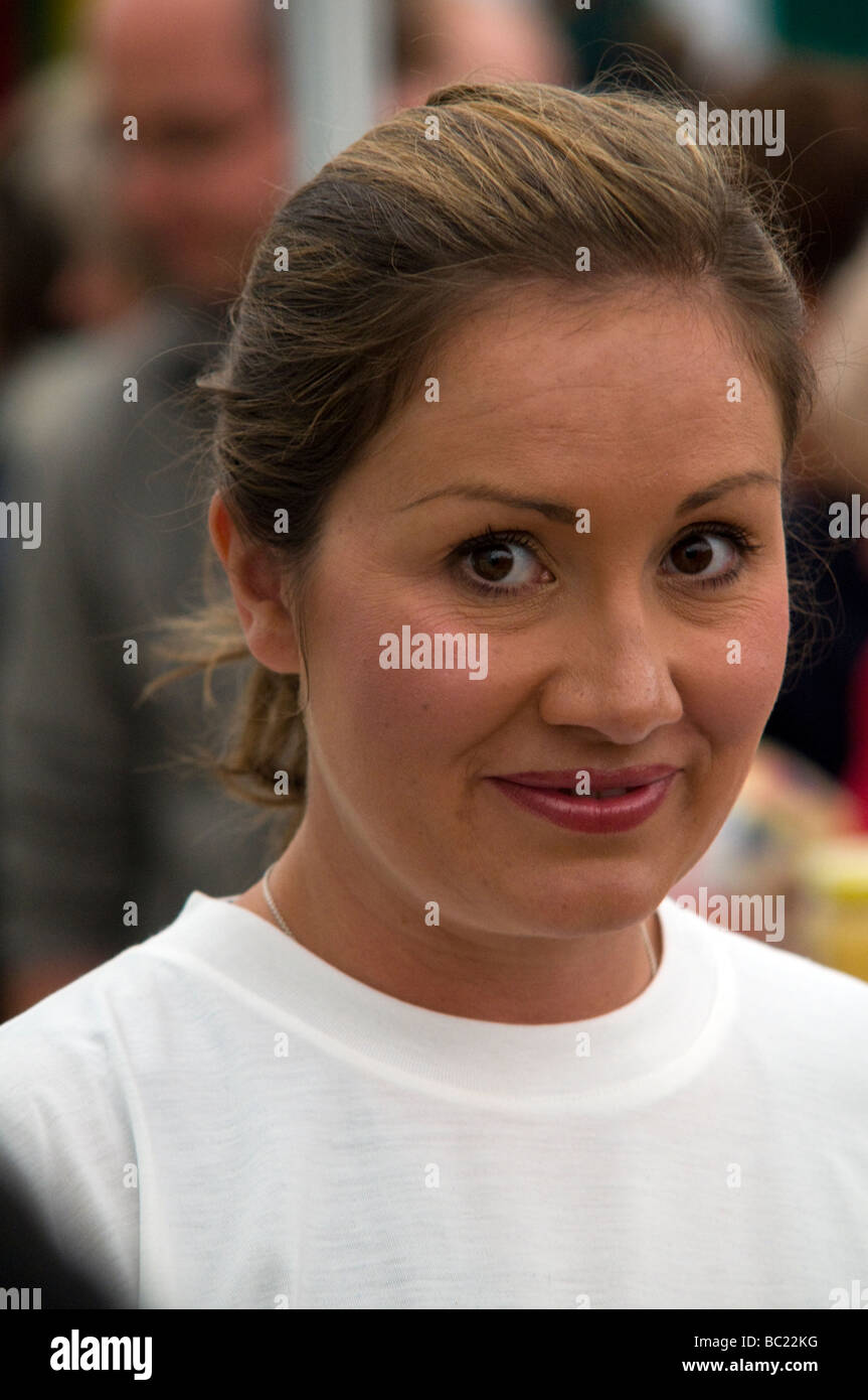 Pretty girl with large brown eyes looking slightly hesitant at camera ...