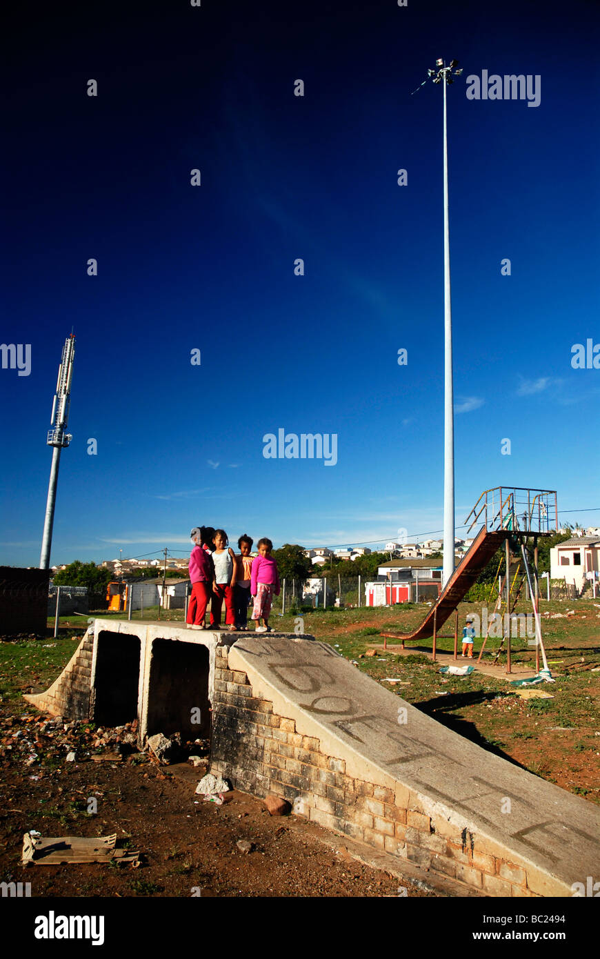 A group of children congregate in a playground in the impoverished ...