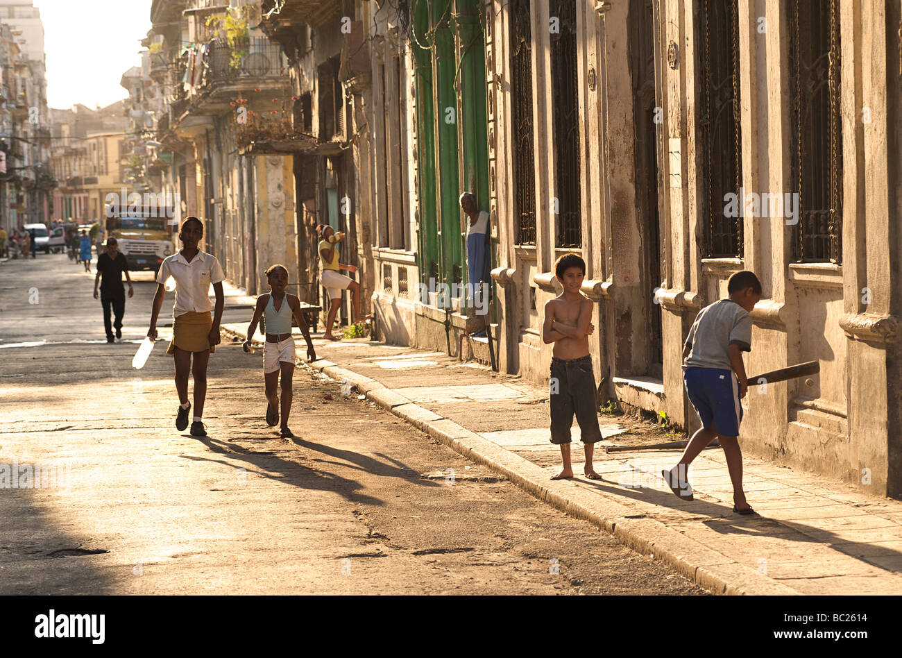 Cuban street scene. Late afternoon in Habana Centro. Children playing ...