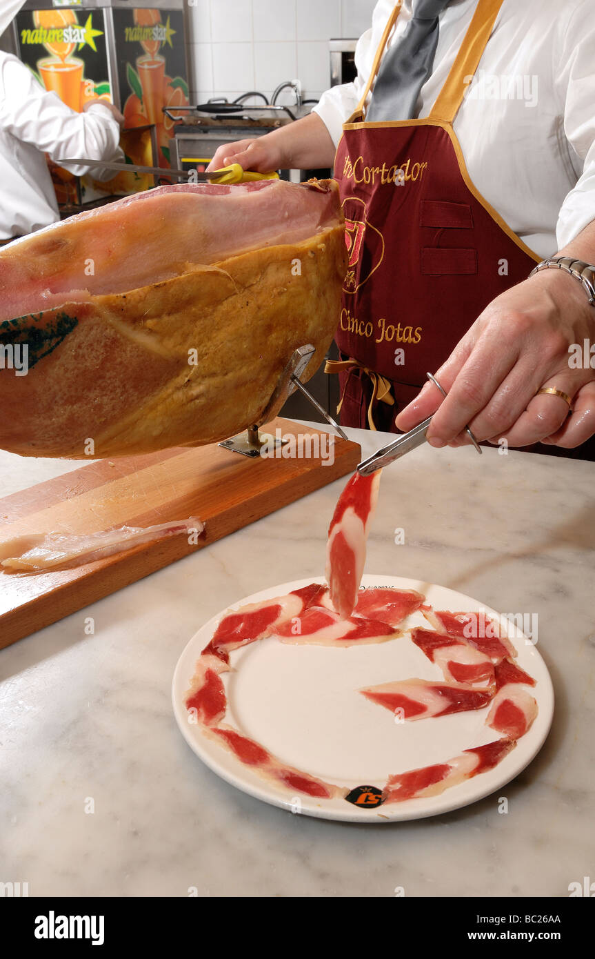 Cutting spanish ham process preparation hi-res stock photography and ...