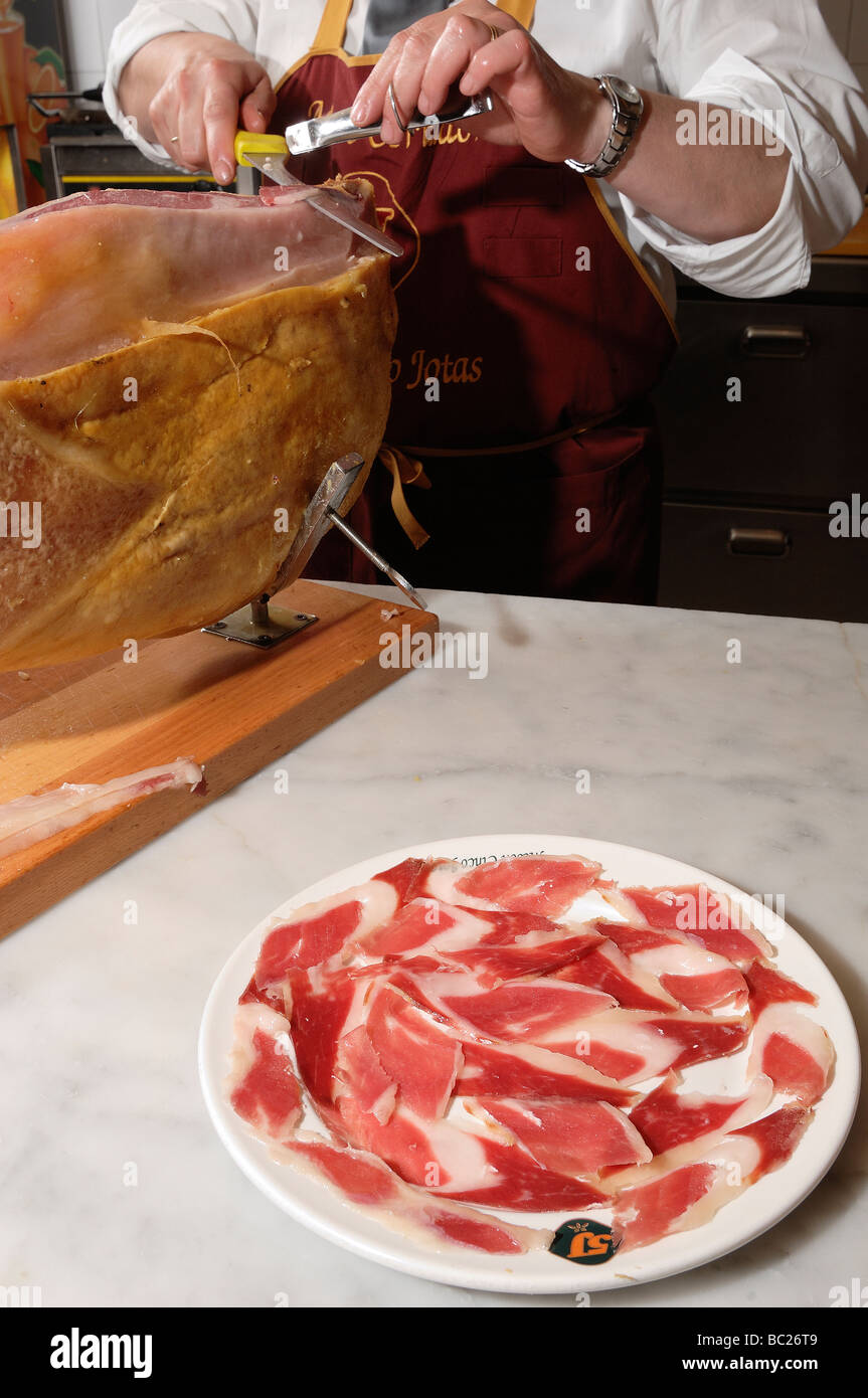 Cutting spanish ham process preparation hi-res stock photography and ...
